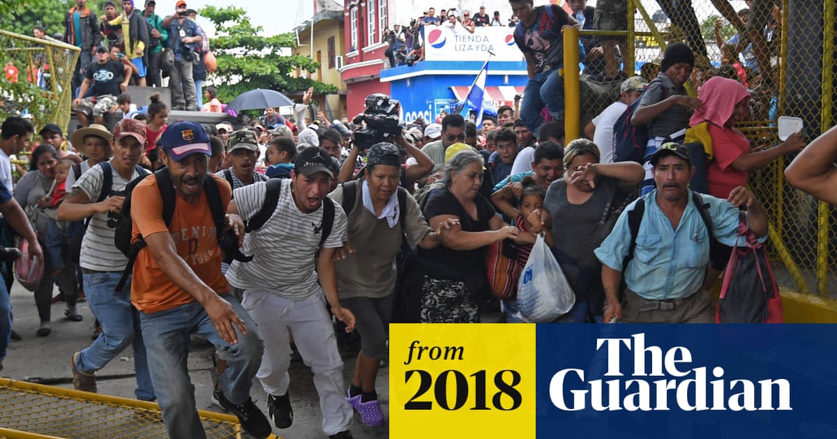 Migrant Caravan In Guatemala Breaks Through Border Fence Into Mexico